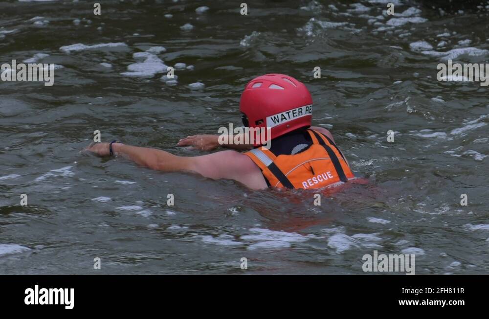 fire fighter swimming during water rescue 4k Stock Video Footage - Alamy
