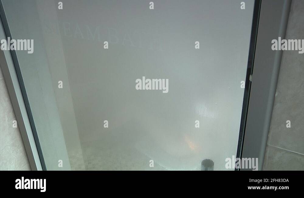 Barely visiable woman in bikini blurred through frosted doors or a ...