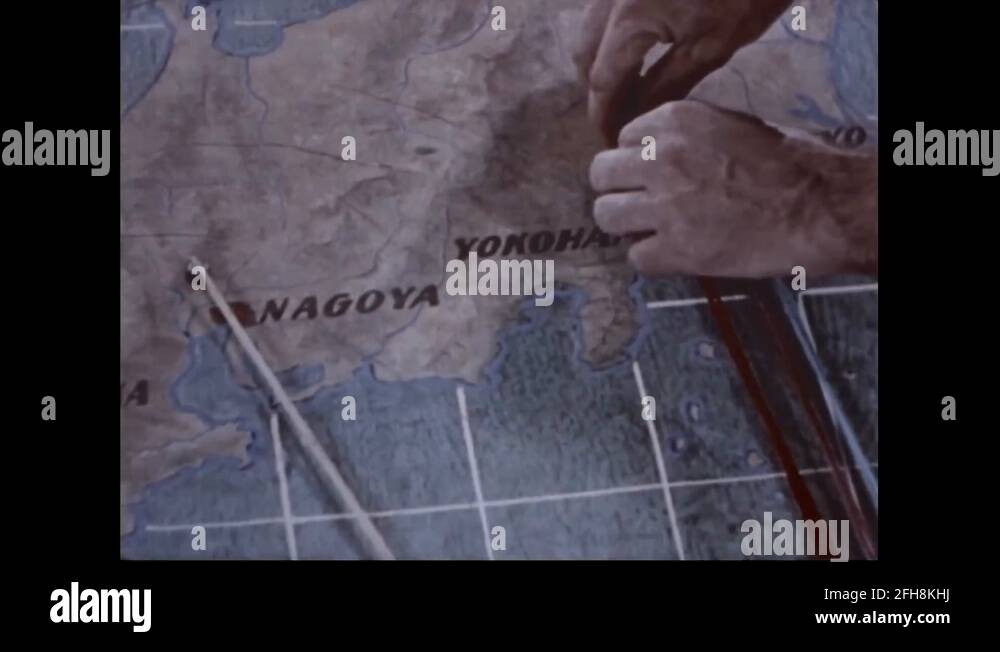 WW2 - US soldier mark flight route on map - Detail Stock Video Footage ...