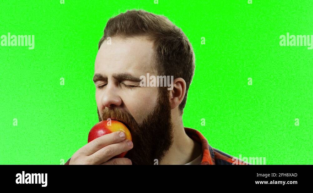 Man biting apple Stock Videos & Footage - HD and 4K Video Clips - Alamy