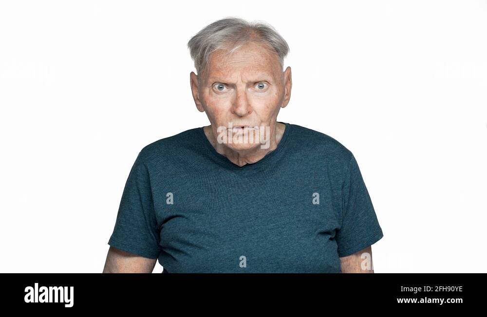 Portrait of angry old aged man 80s in basic t-shirt posing with strict ...