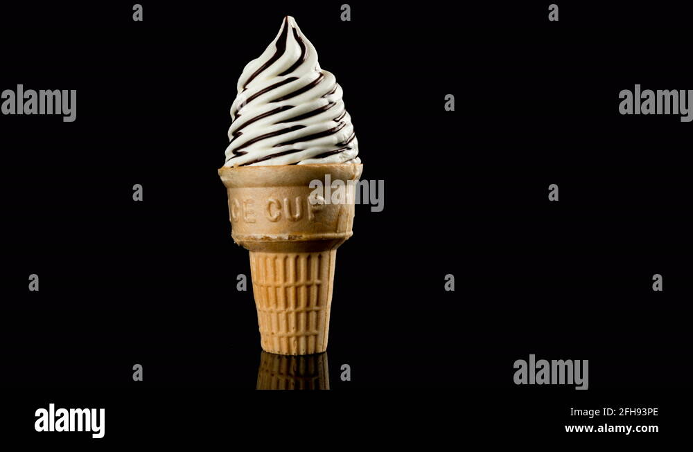 studio shoot of ice cream cone melting process on black background ...