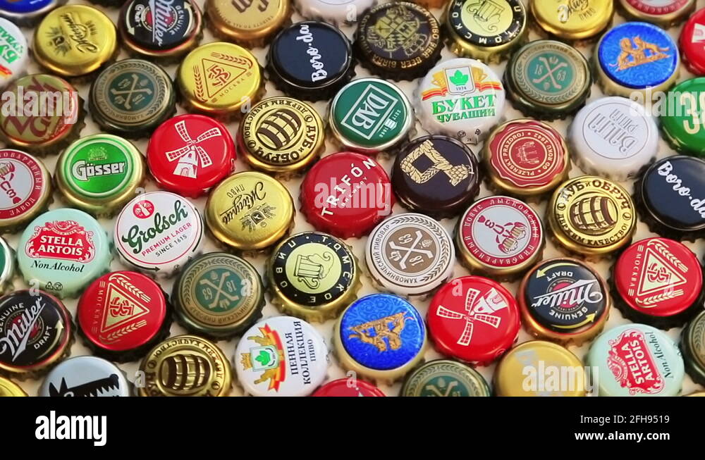 beer bottle caps background, mix of different world brands Stock Video ...