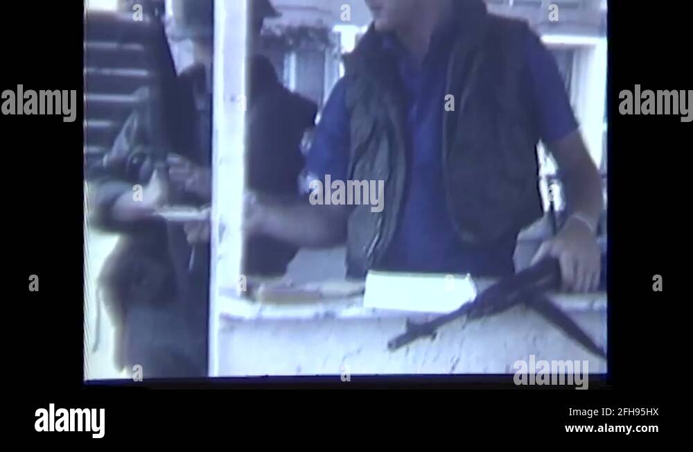 Soldier check the visitor's ID card at the check post- 1968 Stock Video ...