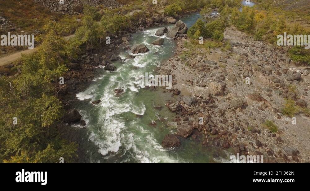 Flight over the Mountains. Altai. Siberia. Flying over the River ...