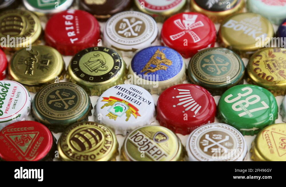 beer bottle caps background, mix of different world brands Stock Video ...