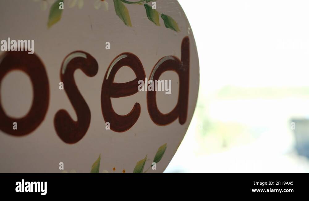 closed sign notice board vintage style hanging on front door in cafe ...