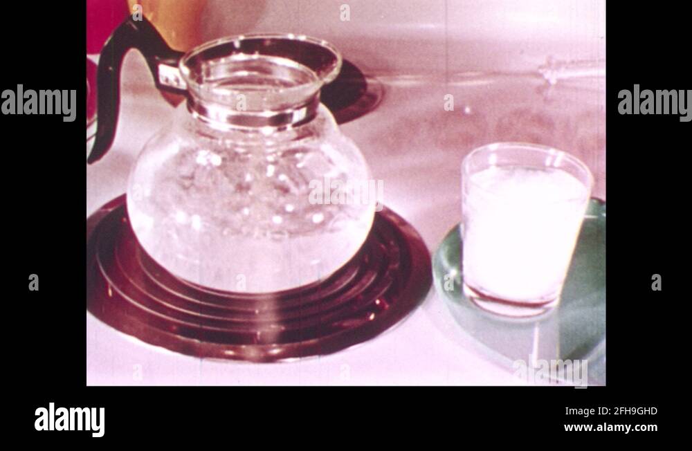 1950s: UNITED STATES: water boils in container. Three states of water ...