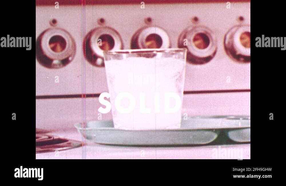1950s: UNITED STATES: Liquid title. Container of ice. Container of ...