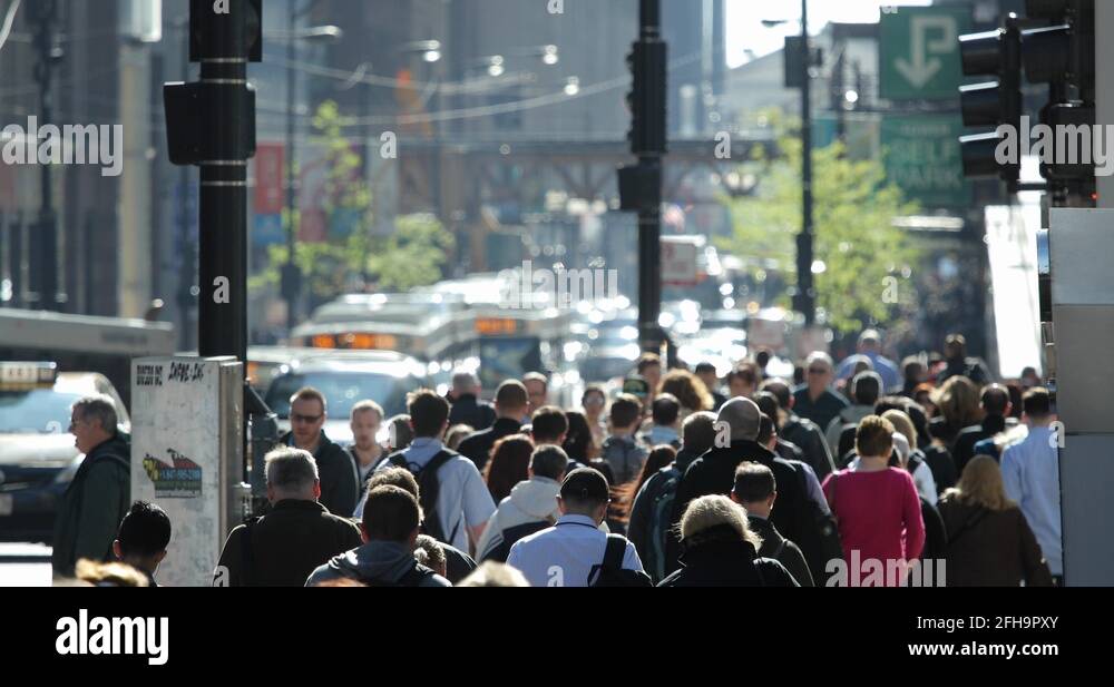 Crowd of commuter people walking street to work backlit silhouette ...