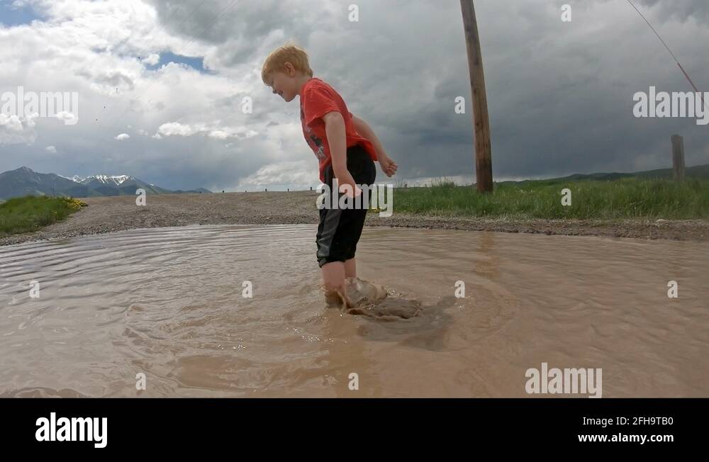 Jumping in mud puddle Stock Videos & Footage - HD and 4K Video Clips ...