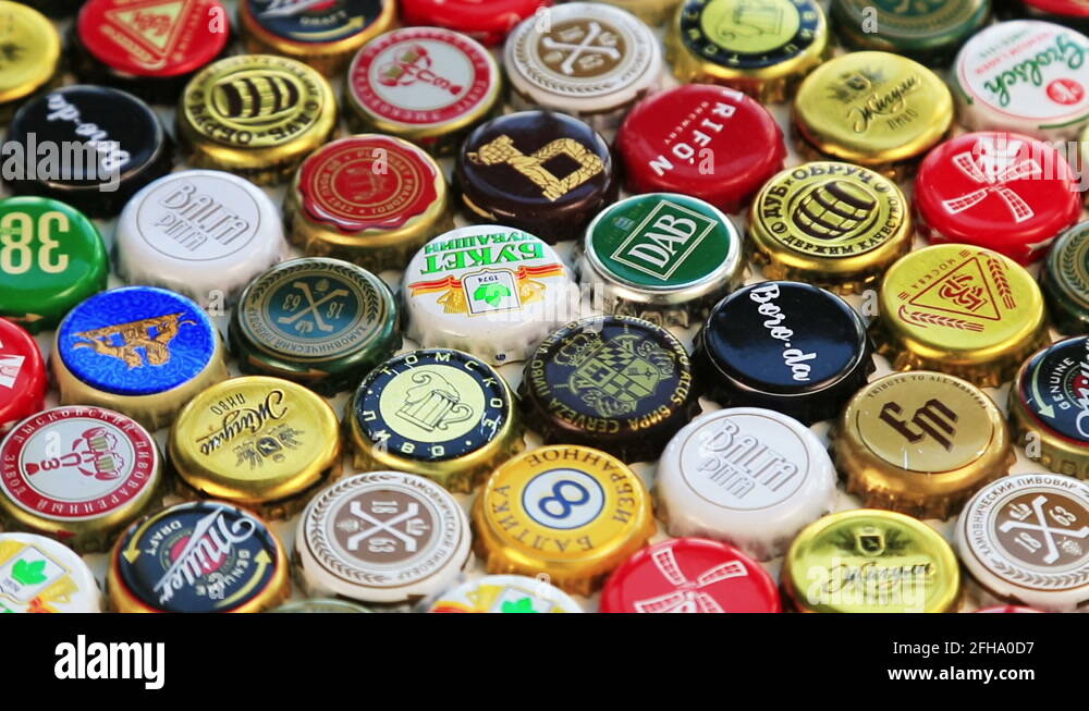 beer bottle caps background, mix of different world brands Stock Video ...