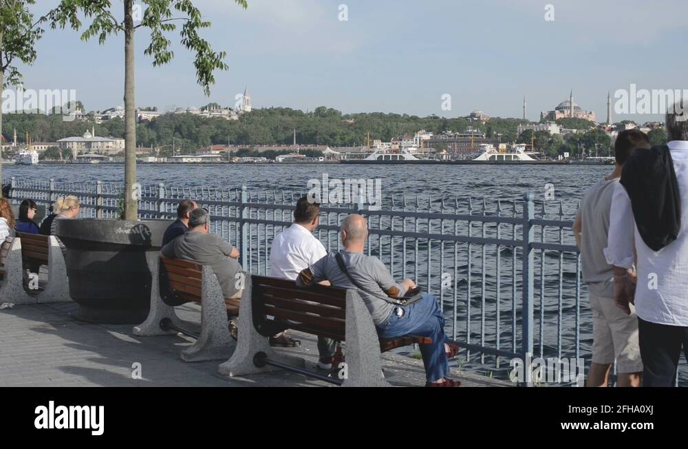 People seated on benches at Karakoy ferry terminal, Istanbul Stock ...