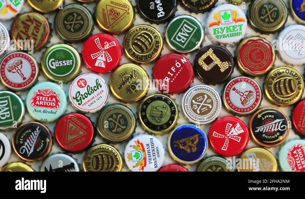 beer bottle caps background, mix of different world brands Stock Video ...