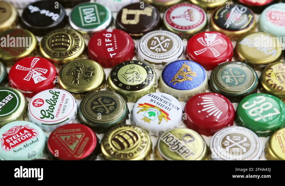 beer bottle caps background, mix of different world brands Stock Video ...