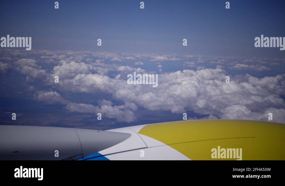 Clouds from the airplane window. A view of the sky with clouds and a ...
