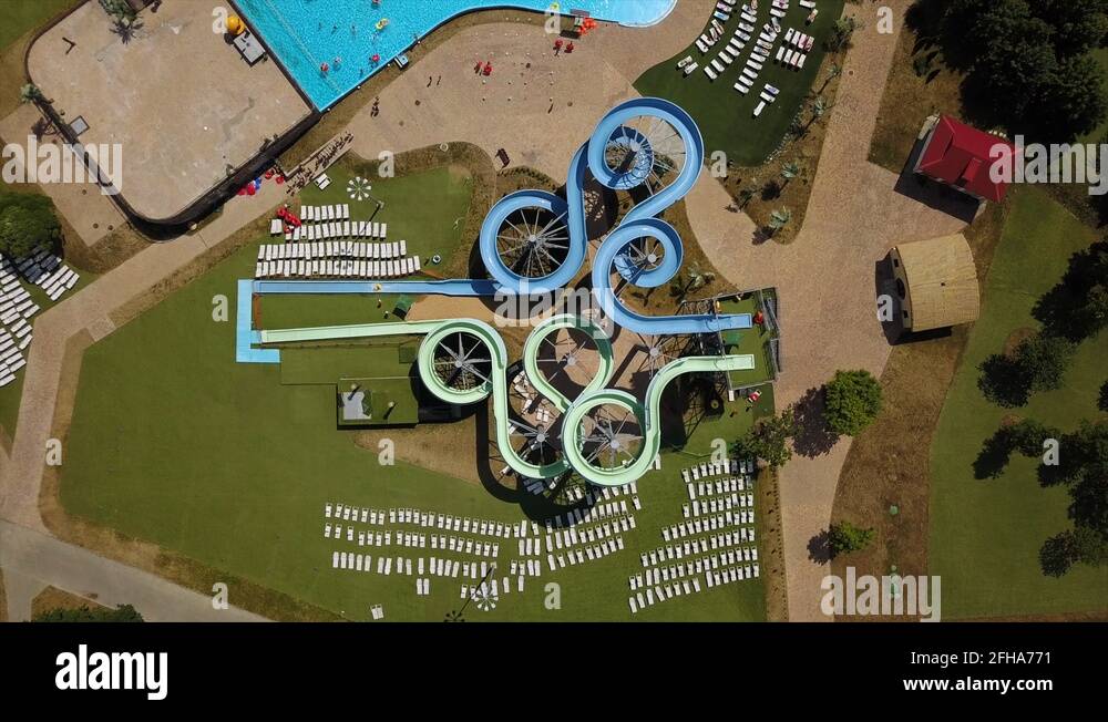 summer day crowded waterpark outdoor swimming pool aerial down view ...