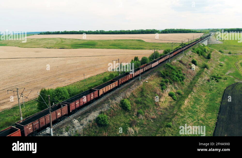Aerial freight train on a long railroad, top view Stock Video Footage ...