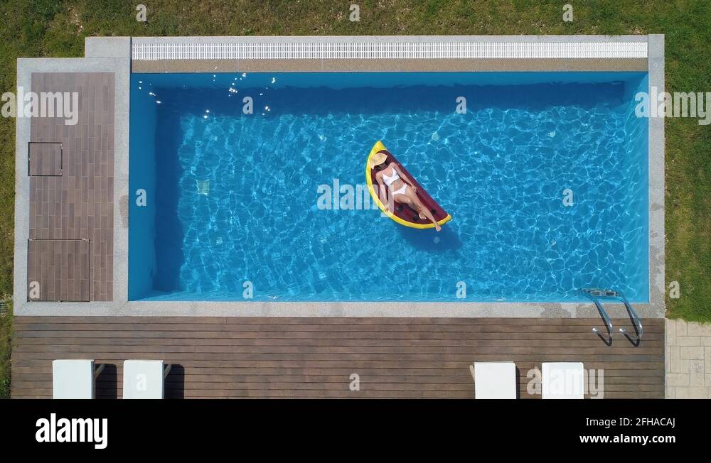 Woman floatie pool Stock Videos & Footage - HD and 4K Video Clips - Alamy