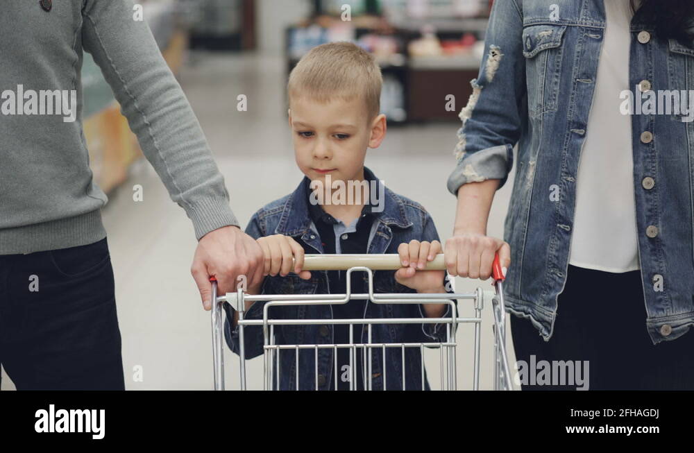 Child trolley supermarket boy pushing trolley Stock Videos & Footage ...
