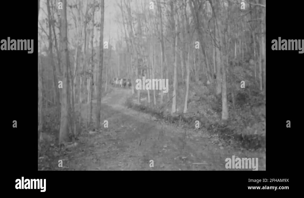 Police and gangster fire each other in forest - 1963 Stock Video ...