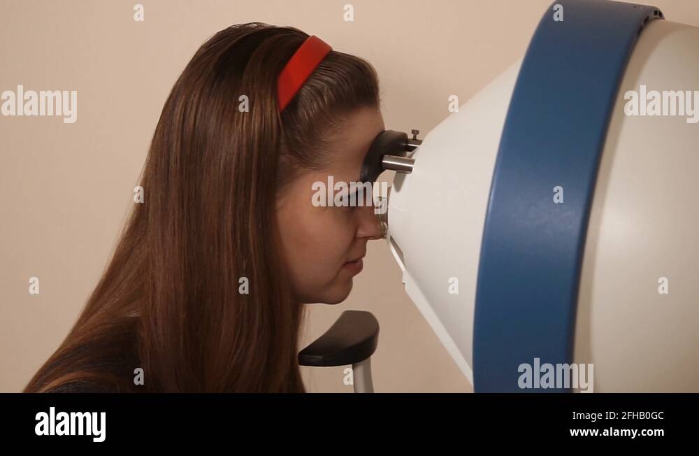woman who undergoes a Visionometry procedure to determine visual acuity ...
