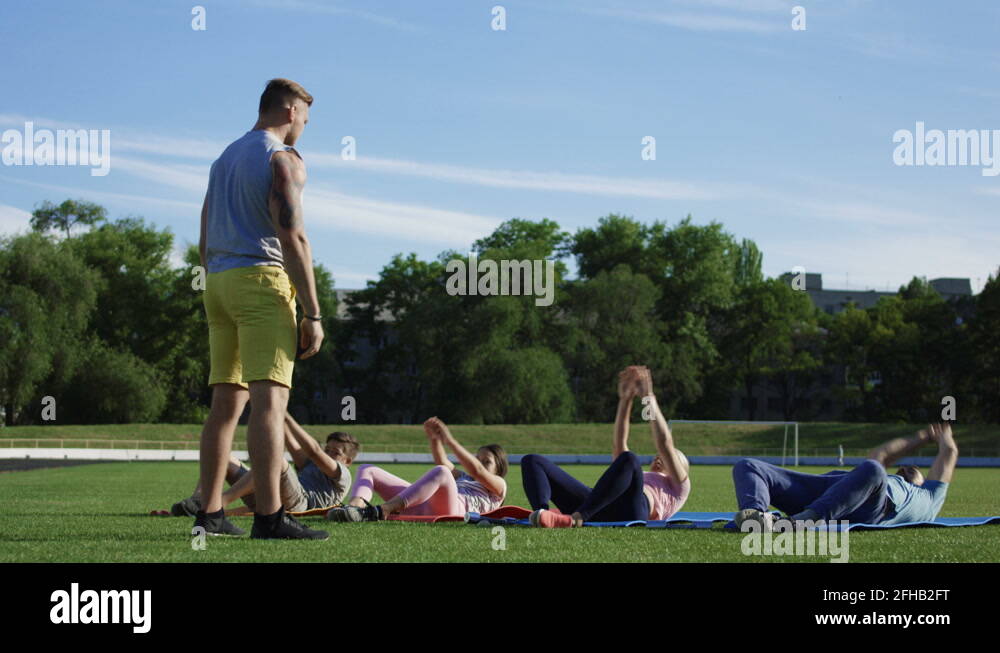 Family working out together on stadium Stock Video Footage - Alamy