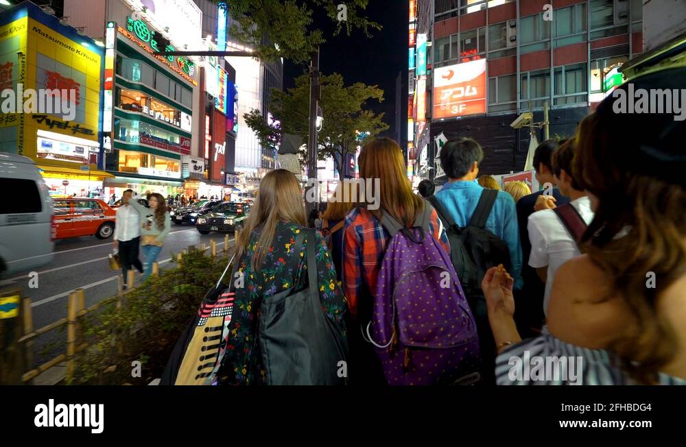 People cross the famous intersection in Shibuya, Tokyo, Japan Stock ...