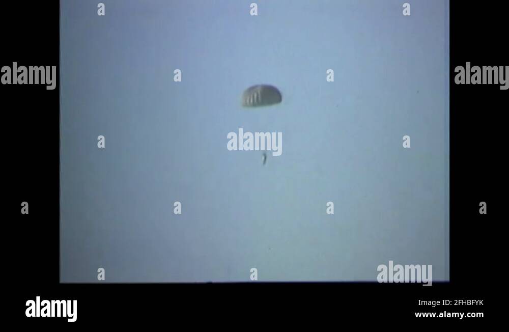 CIDG soldiers parachutes float down during airborne training - 1969 ...