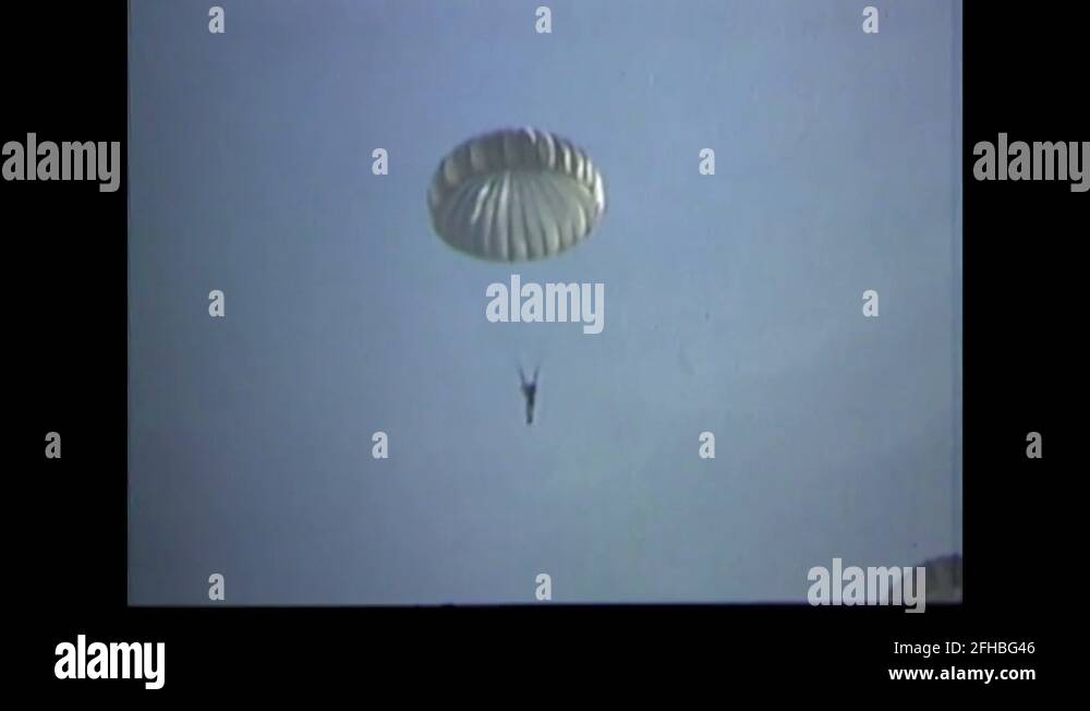 CIDG soldiers parachutes float down during airborne training - 1969 ...