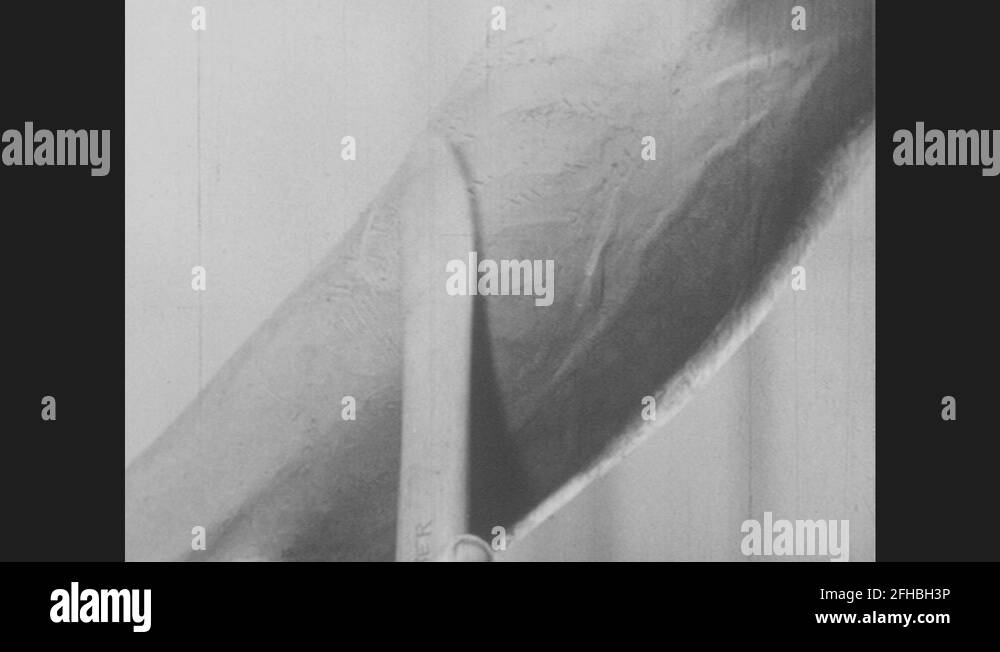 1940s: UNITED STATES: hand creates texture of skin on clay model. Veins ...