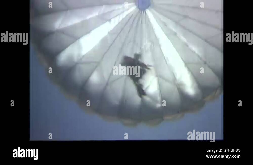 CIDG soldiers parachutes float down during airborne training - 1969 ...