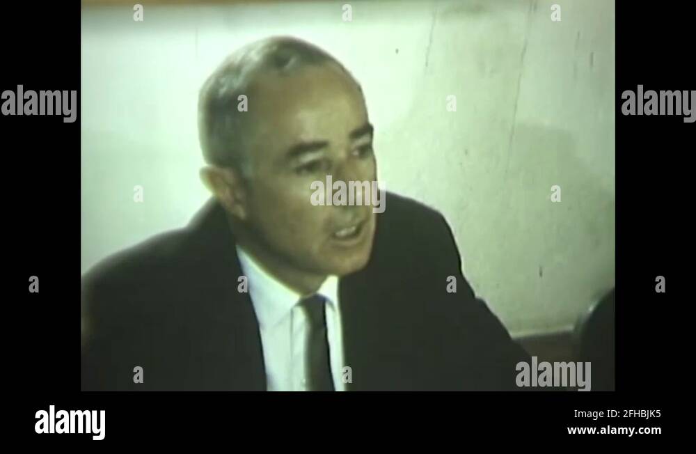 U.S. and Latin Military Group advisors seated around conference table ...