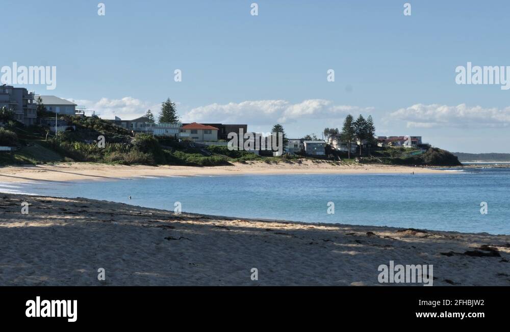 Australian beach scene showing headland and houses Stock Video Footage ...