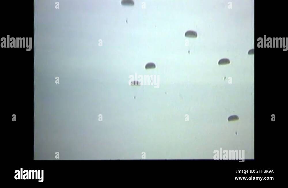 CIDG soldiers parachutes float down during airborne training - 1969 ...