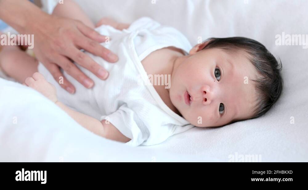 Mother resting hand on baby Stock Videos & Footage - HD and 4K Video ...