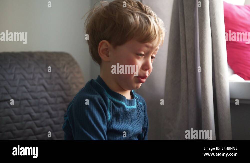 Upset little boy hugging his mother and crying at home Stock Video ...