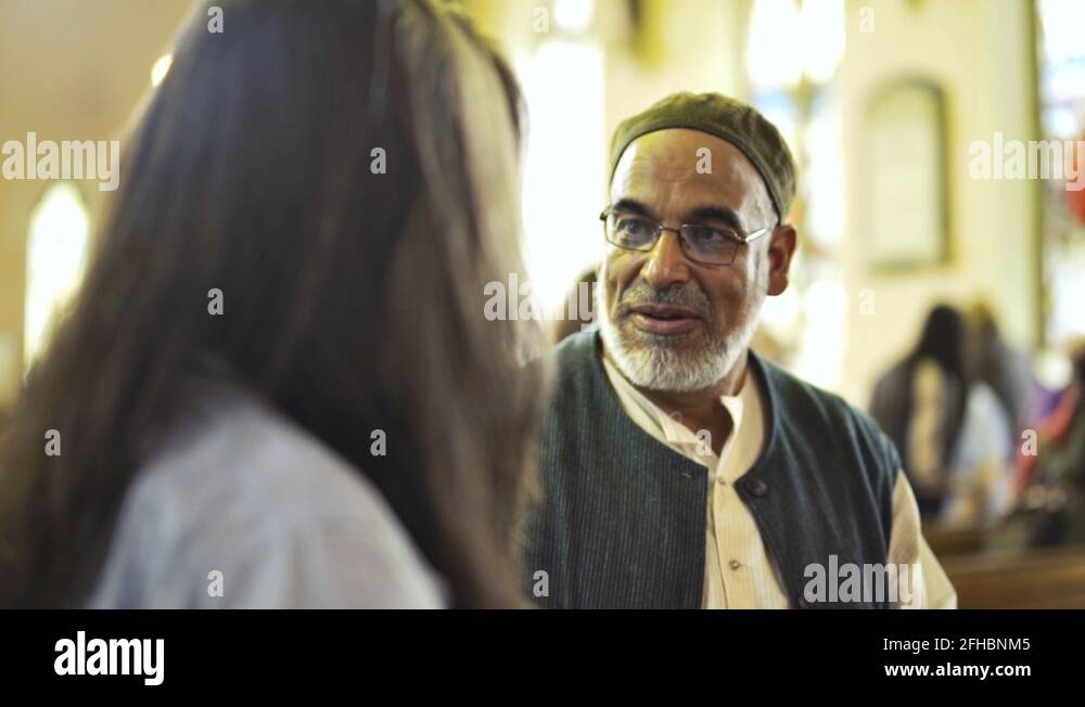 A Pakistani man talking to a girl in a church in Slow Motion Stock ...