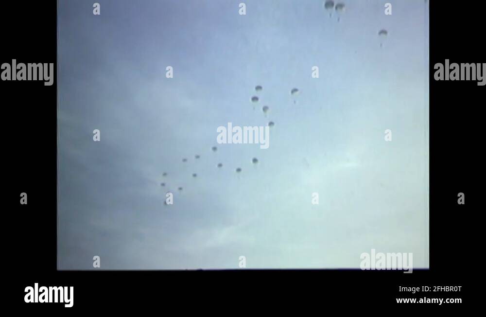 CIDG soldiers parachutes float down during airborne training - 1969 ...