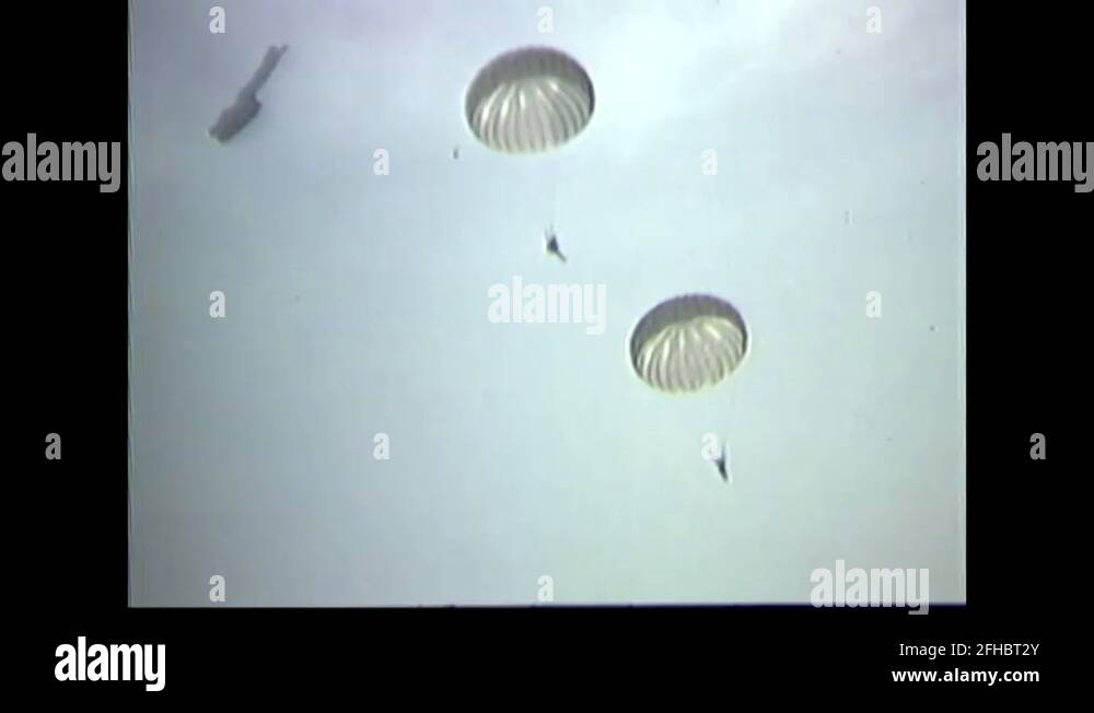 CIDG soldiers parachutes float down during airborne training - 1969 ...
