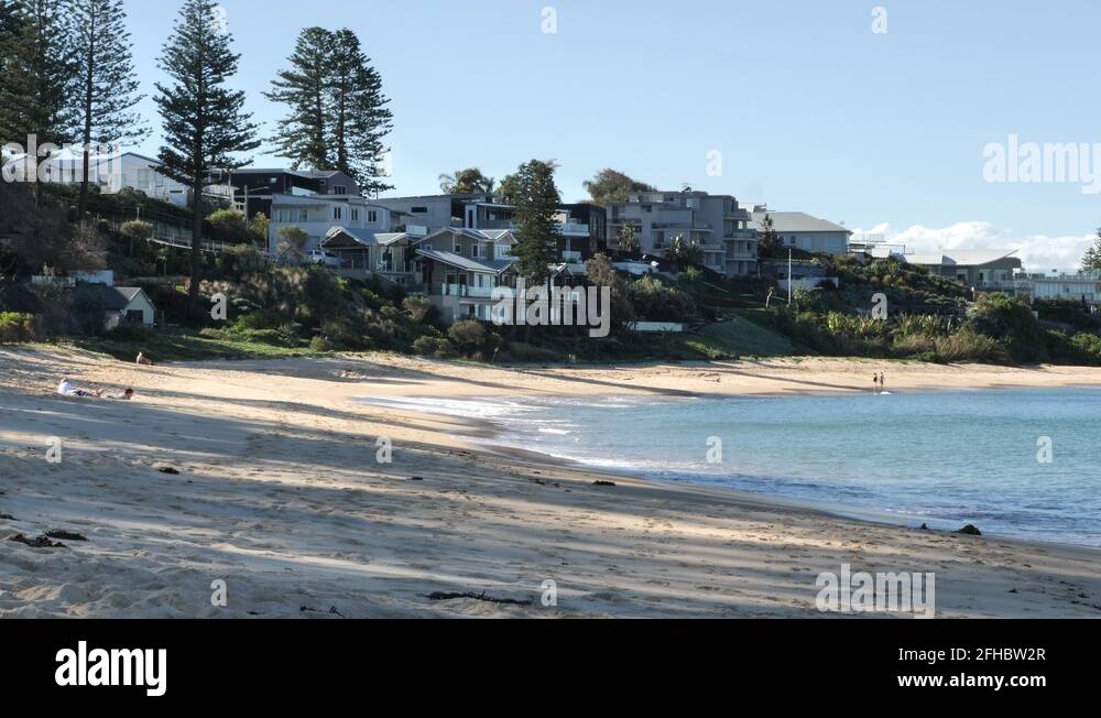Australian beach scene showing headland and houses Stock Video Footage ...