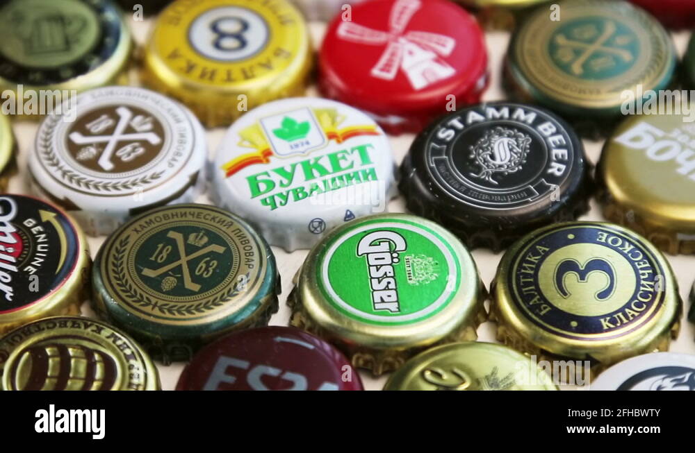 beer bottle caps background, mix of different world brands Stock Video ...