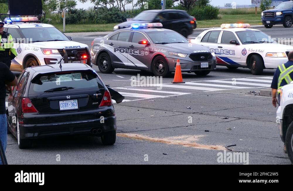 Police officers tow trucks and fire at car accident and crash in city ...