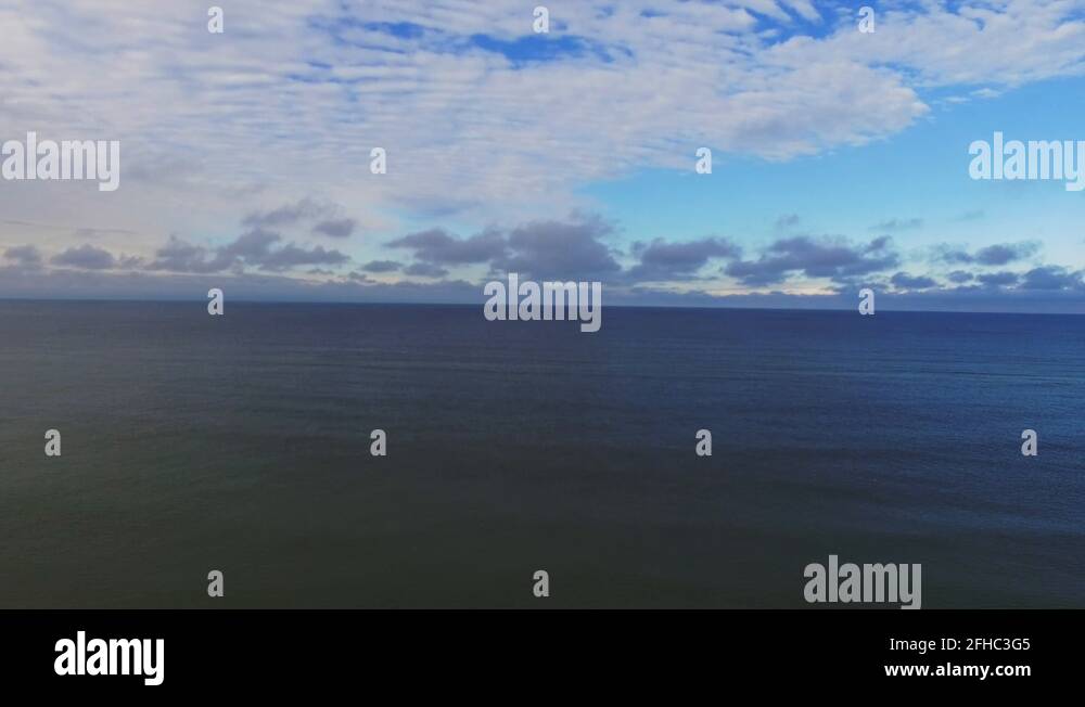 Ocean flyover with clouds Stock Video Footage - Alamy