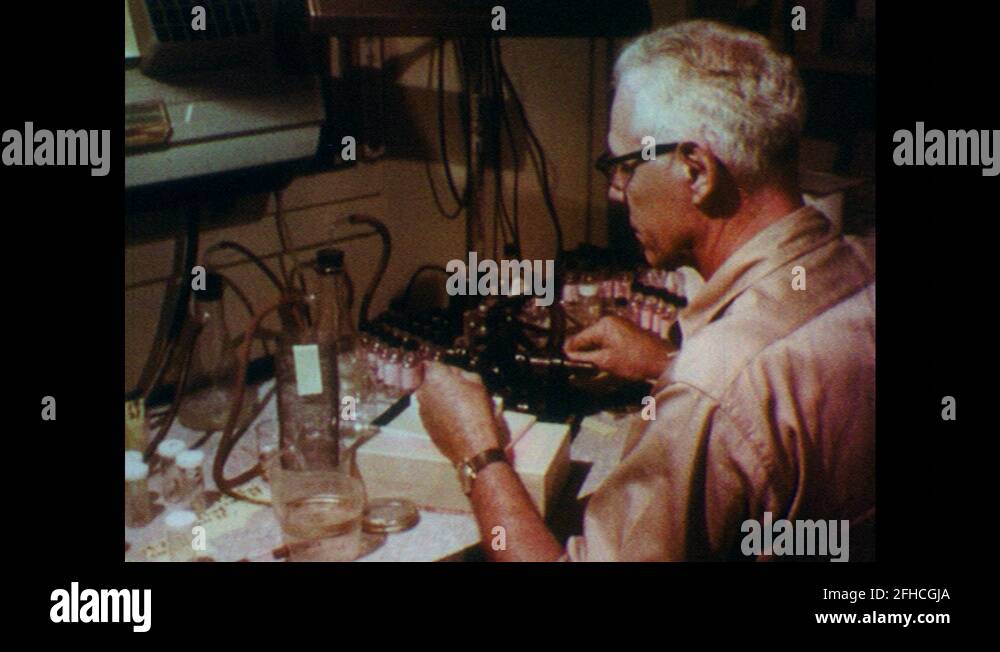 1960s: UNITED STATES: man works in science lab. Researcher develops ...
