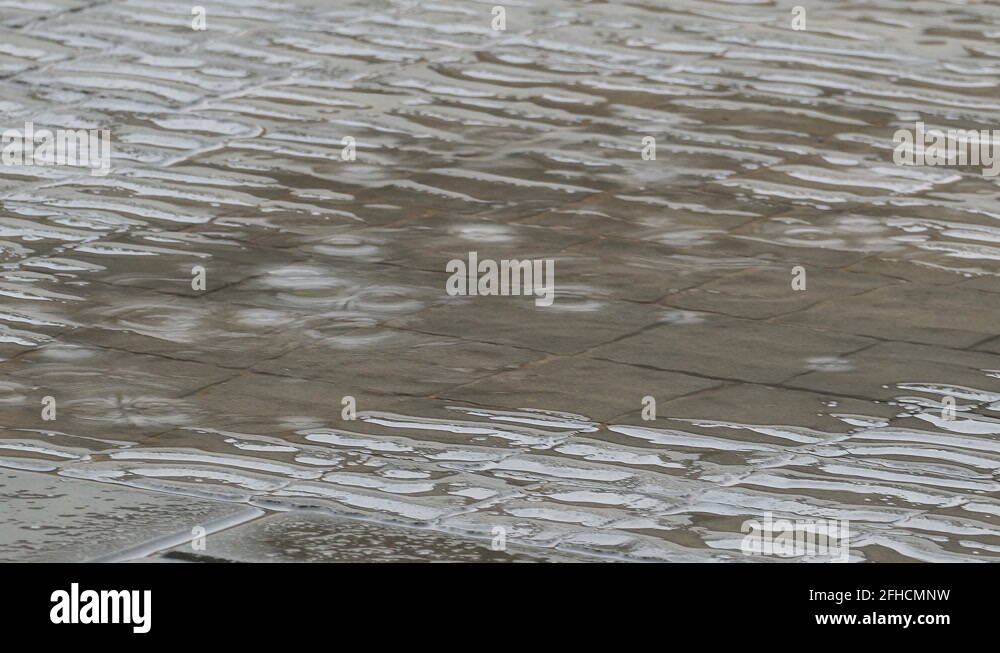 Rain puddle street Stock Videos & Footage - HD and 4K Video Clips - Alamy