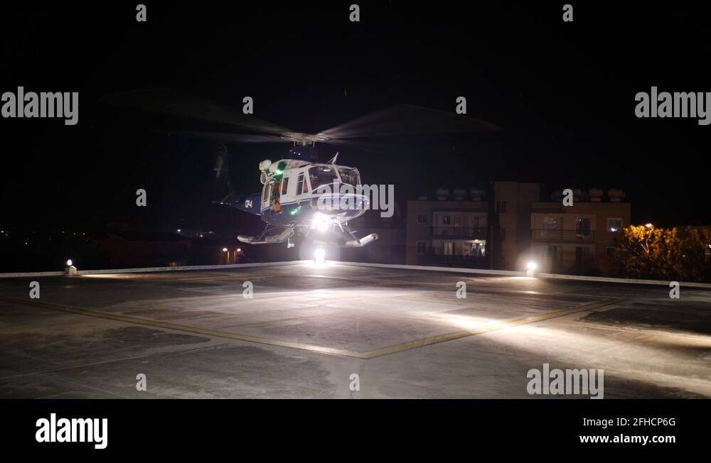 A police helicopter lands on a rooftop helipad at Paphos General ...