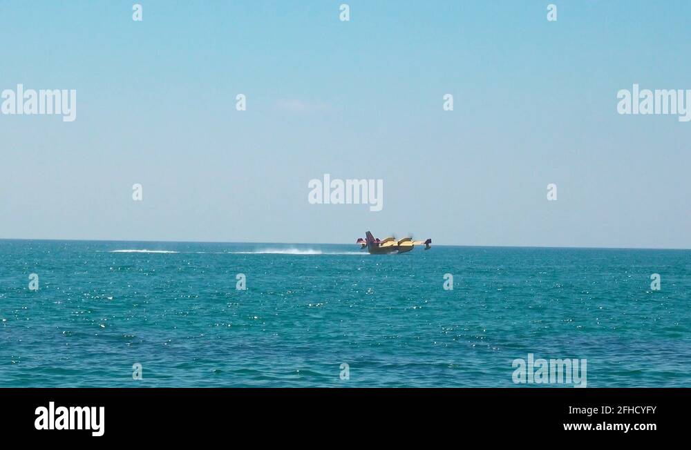 Firefighting aircraft in an emergency situation, water intake Stock ...