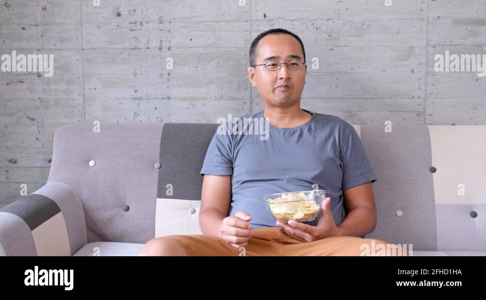 Man eating snack Stock Videos & Footage - HD and 4K Video Clips - Alamy