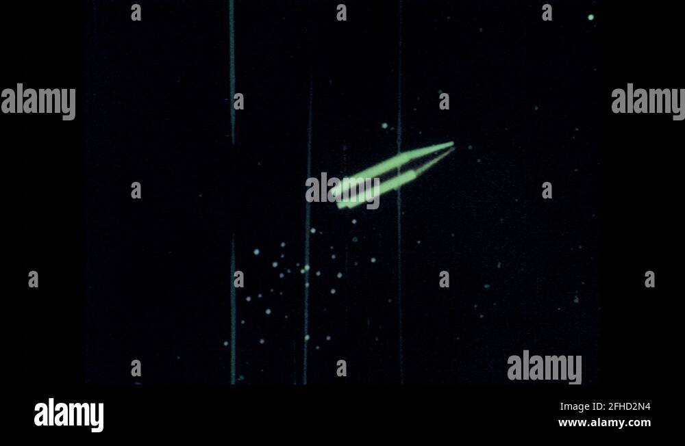 1960s: Rocket ship flies through outer space at a uniform speed Stock ...